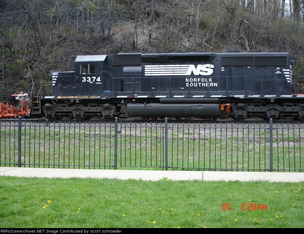 NS 3374 pushes long-hood forward at the rear of an EB Manifest Train